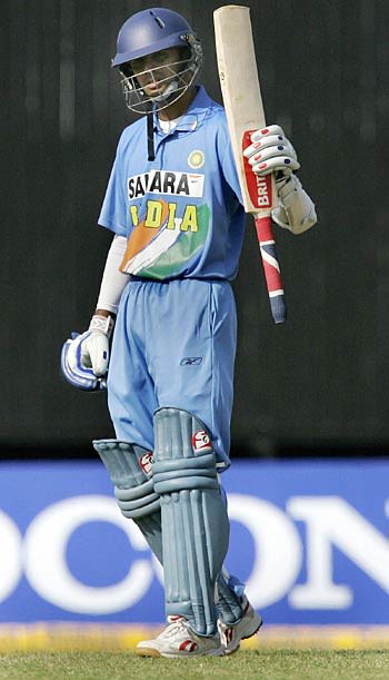 Rahul Dravid acknowledges the crowd's applause after reaching his fifty ...