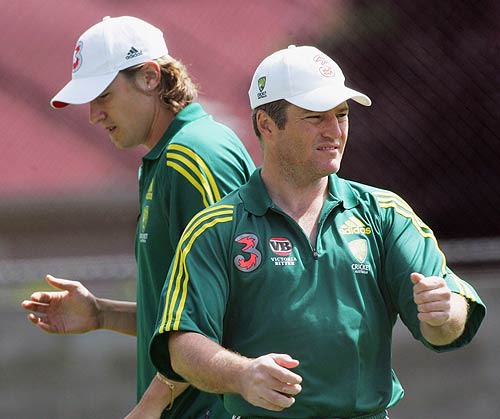 Nathan Bracken and Stuart MacGill look on during training ...
