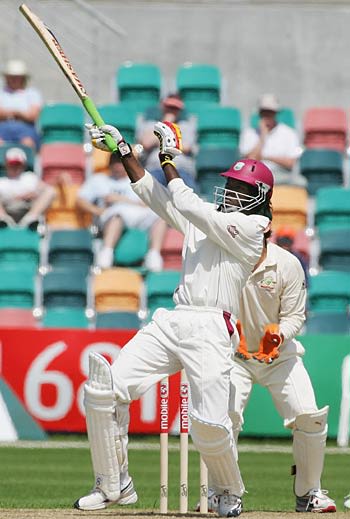 Chris Gayle pulls Shane Warne for a six even as the bottom hand comes ...