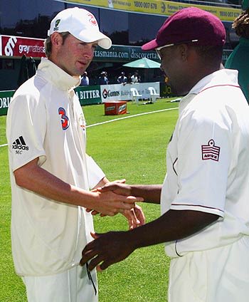 Michael Clarke and Brian Lara exchange a few words at the end of the ...