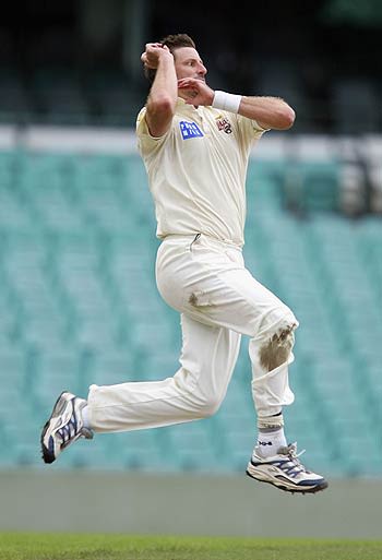 Michael Kasprowicz bowls for Queensland | ESPNcricinfo.com