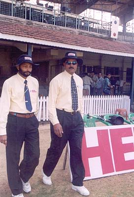 Umpires K Hariharan and SC Gupta enter the field before the start ...