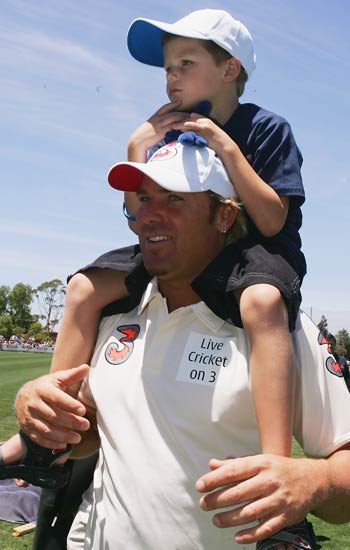 Shane Warne and his son during a match between an Australia XI and the ...