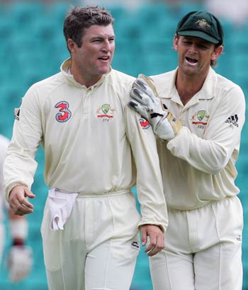 Adam Gilchrist congratulates Stuart MacGill after the dismissal of ...