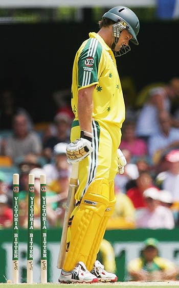 Adam Gilchrist is dismayed after being bowled off the first ball ...