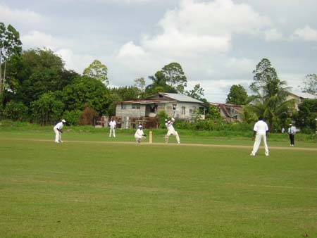 Young Arun Gokoel (Suriname) smashes a ball through the covers ...