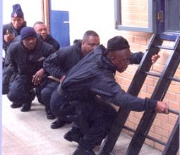 The Royal Barbados Police Force gets ready to storm a building ...