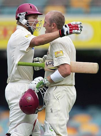 Shane Watson congratulates Clinton Perren on reaching his century ...