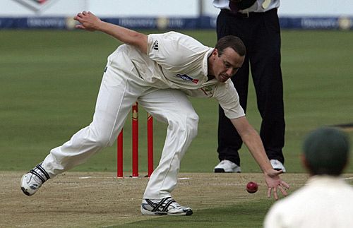 Stuart Clark stoops to stop the ball | ESPNcricinfo.com