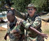 A St Vincent soldier goes through a drill with a United States Marine ...