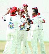Trinidad and Tobago celebrate the fall of a wicket | ESPNcricinfo.com