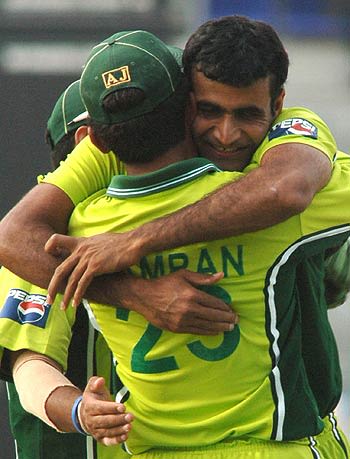 Rao Iftikhar Anjum and Imran Farhat celebrate the wicket of Yuvraj ...