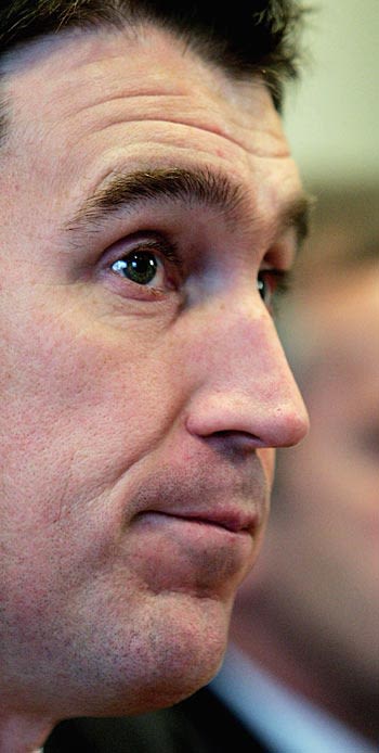 James Sutherland feels the heat as he answers media questions about ...