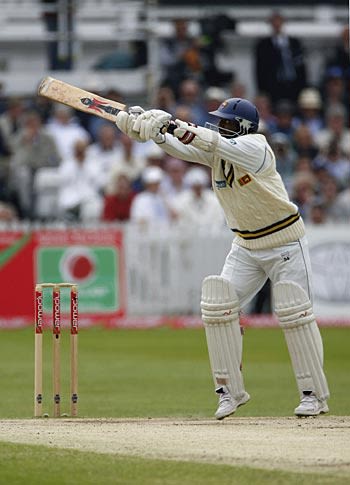 Mercurial Murali: Muttiah Muralitharan chips a bouncer over the covers ...