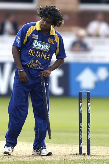 Lasith Malinga takes a souvenir after bowling the final over ...