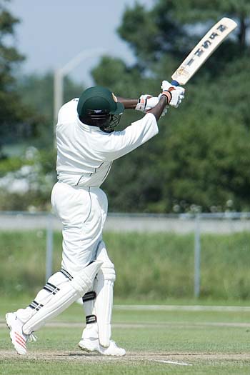 Collins Obuya in action | ESPNcricinfo.com