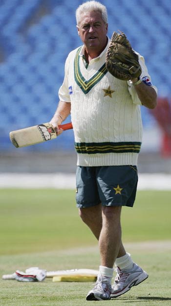 Bob Woolmer gets his point across during a practice session ...