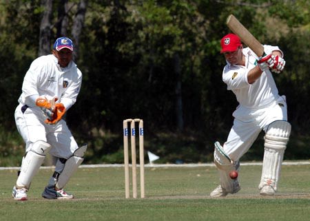 Ian Billcliff drives for four towards his century, Dean Minors is the ...