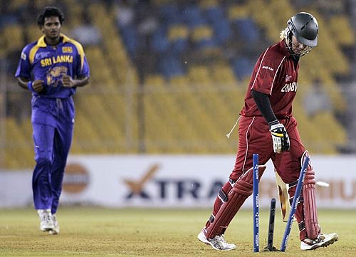 Brendan Taylor crosses his knocked over stumps | ESPNcricinfo.com
