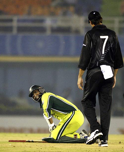 Cor, that's gotta hurt: Mohammad Yousuf manages to smile after being hit between the knee-rolls ...