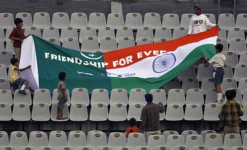 Fans display Indian and Pakistan flags stitched together with the words ...