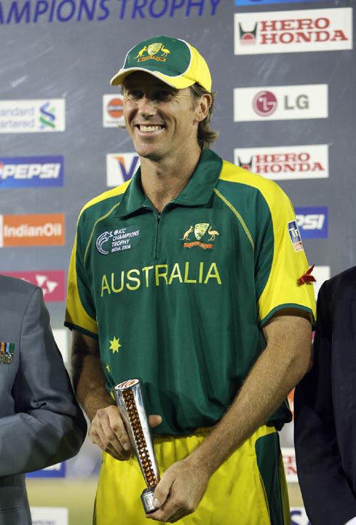 Flying pigeon. Glenn McGrath poses with the man-of-the-match award | ESPNcricinfo.com