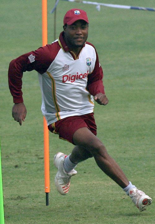 Brian Lara takes part in a practice session at Gadaffi Cricket Stadium ...