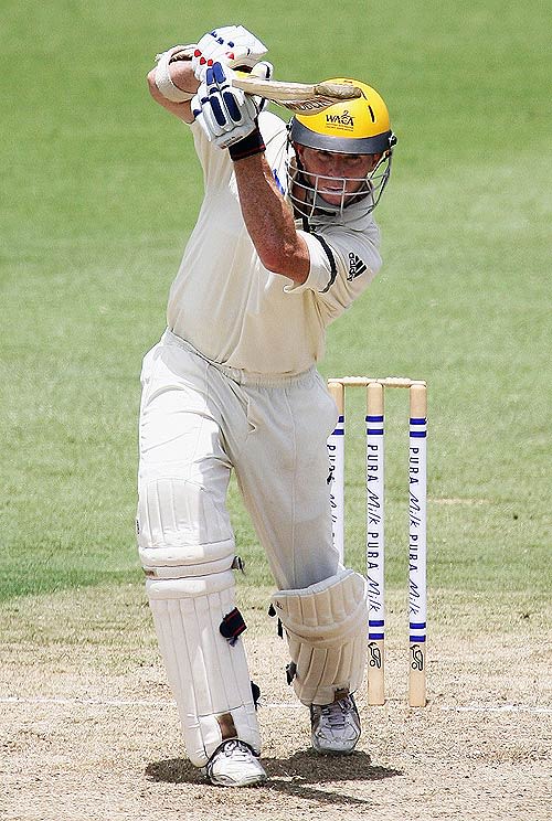 Chris Rogers drives on his way to a half-century against Queensland ...