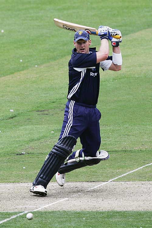 Cameron White powers through the off side during his 76-ball 50 ...