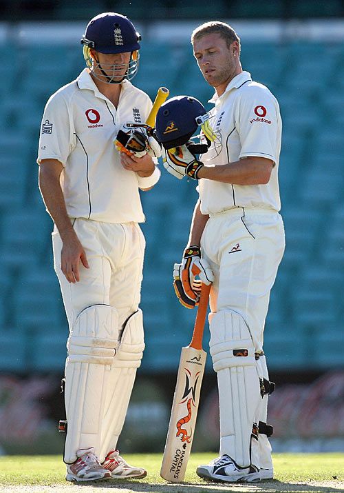 Andrew Flintoff checks his helmet for damage | ESPNcricinfo.com