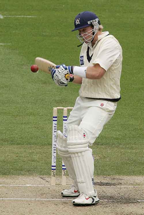 Cameron White prepares to guide the ball away during his 150 ...