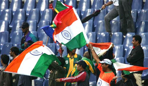 The Indian fans do their best to keep themselves entertained ...