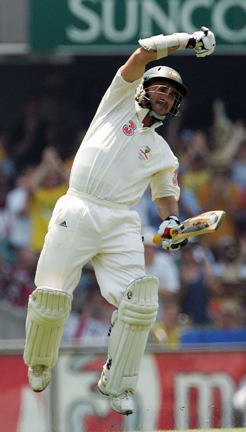 Justin Langer raises his bat and celebrates his hundred against England ...