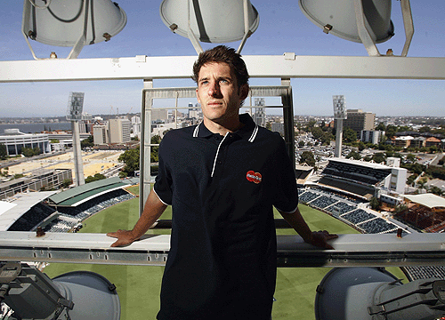 Michael Hussey poses at the light tower of the WACA at Perth ...