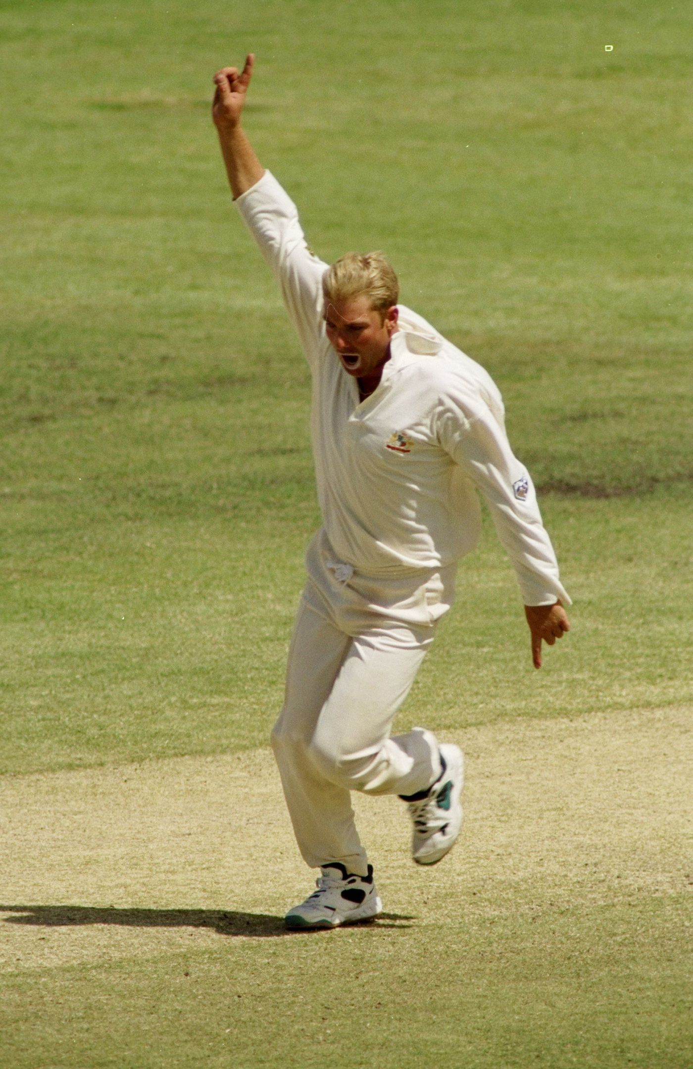 Shane Warne celebrates one of his eight second-inning wickets ...