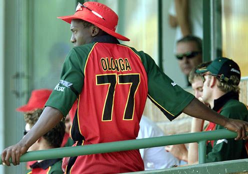 Henry Olonga wears a black armband in protest while in the players ...