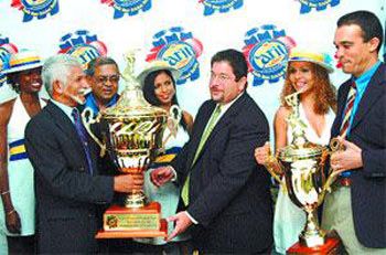 Deryck Murray receives the Carib International Challenge Trophy from ...