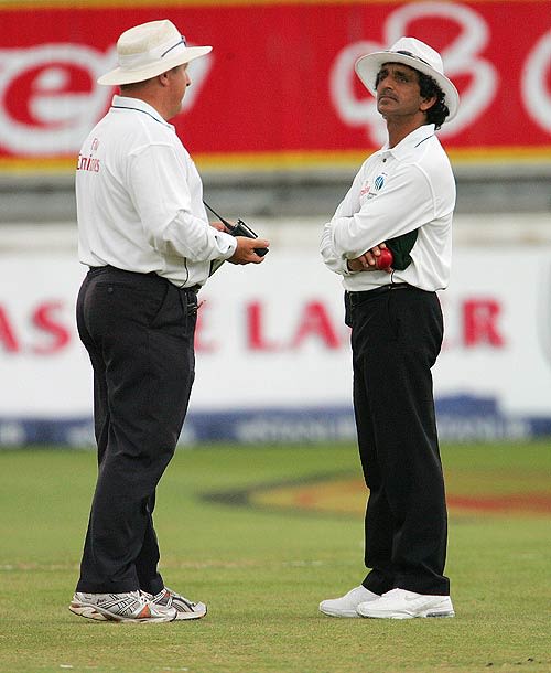 Umpires Ian Howell and Asad Rauf in discussion about the fading light ...