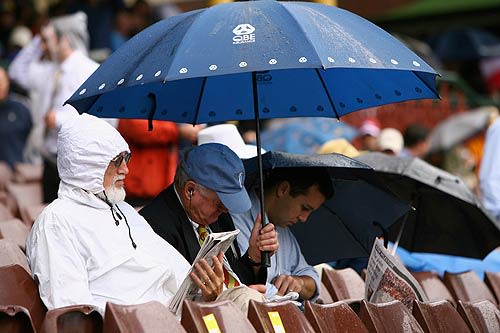 The spectators persisted on day one, waiting for play to begin on a ...