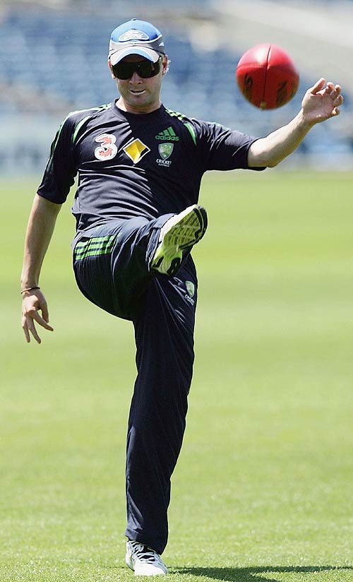 Michael Clarke warms up with some Aussie rules football | ESPNcricinfo.com