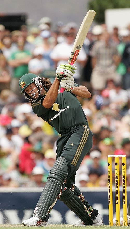 Andrew Symonds smashes a four over midwicket during his innings of 69 ...