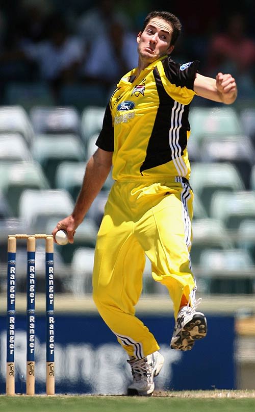 Ben Edmondson sends down a delivery during his spell of 5 for 39 ...