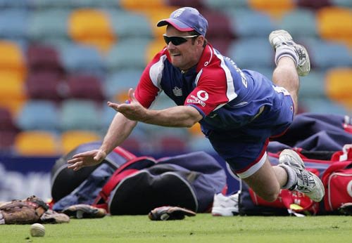 Andrew Strauss makes a diving effort during practice at the Gabba ...
