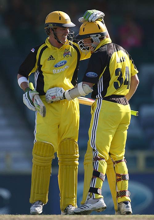 Marcus North congratulates Luke Ronchi after reaching his century ...