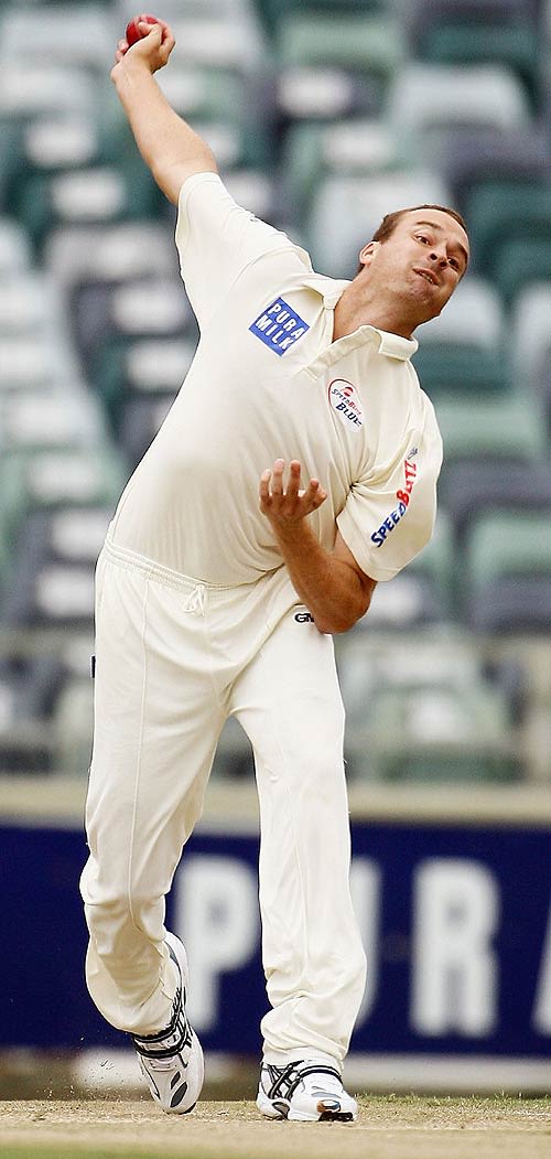 Stuart Clark sends one down on his way to 8 for 58 | ESPNcricinfo.com