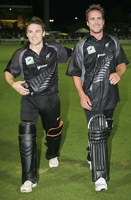 Brendon McCullum and Mark Gillespie walk off, all smiles, after beating ...