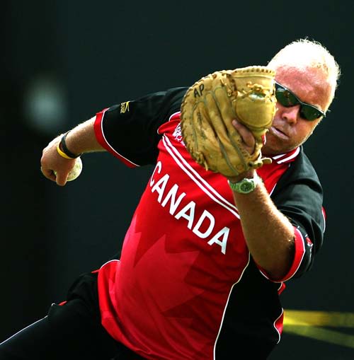 Andy Pick, the Canada coach, dishes out the fielding practise ...