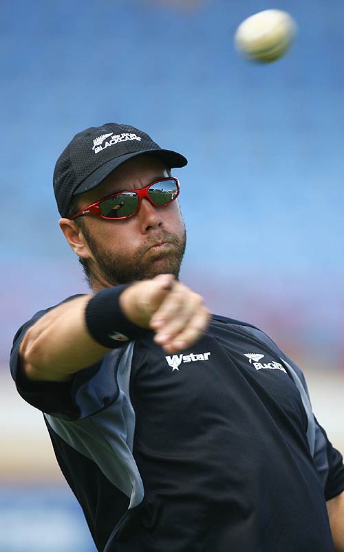 Craig McMillan throws a ball at New Zealand's training session ...