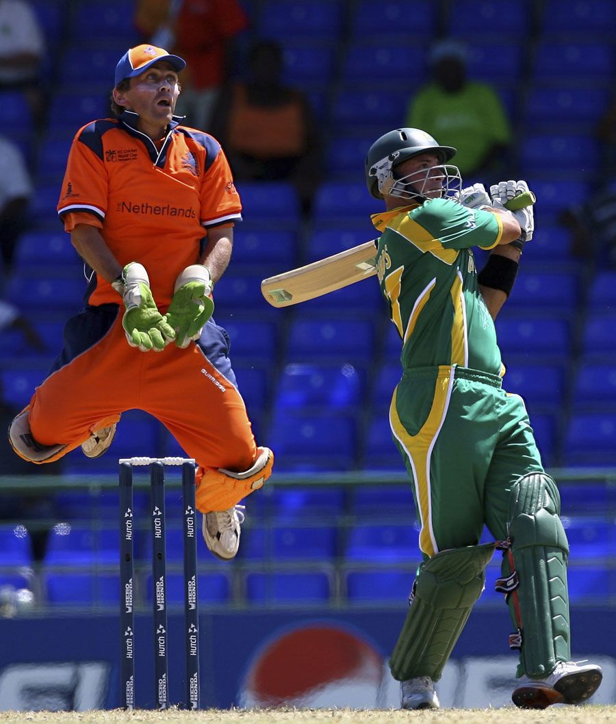 Herschelle Gibbs slap-slogs his fourth six over deep midwicket ...