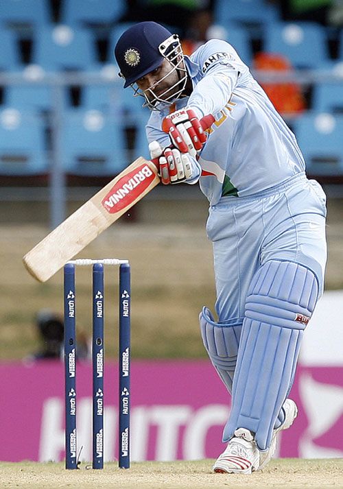 Virender Sehwag drives on his way to his half-century | ESPNcricinfo.com